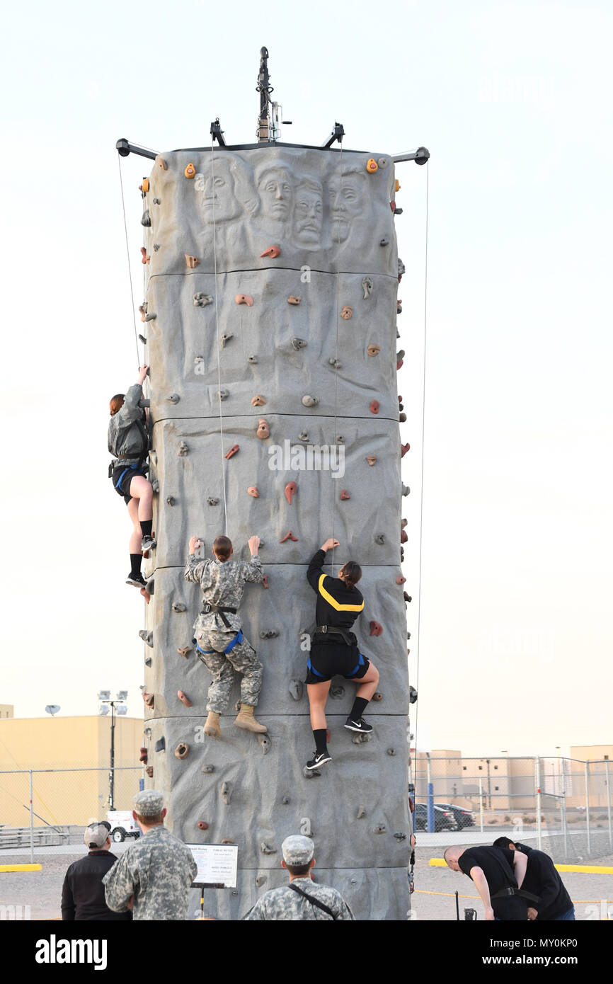 Soldiers climb a rock wall during “Party in the Desert,” an event ...