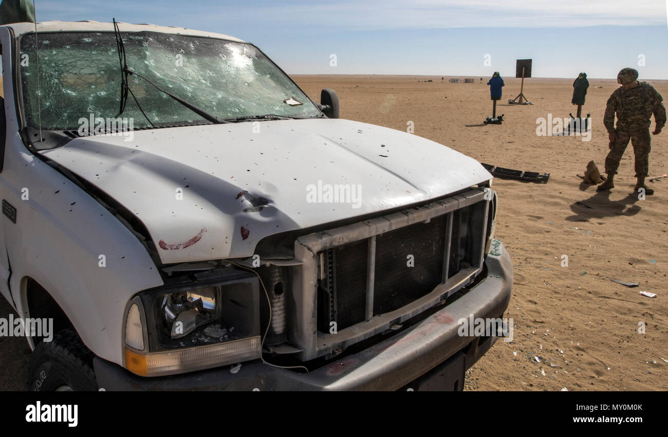 A truck on test-firing lanes at Udairi Training Range, Kuwait, shows ...