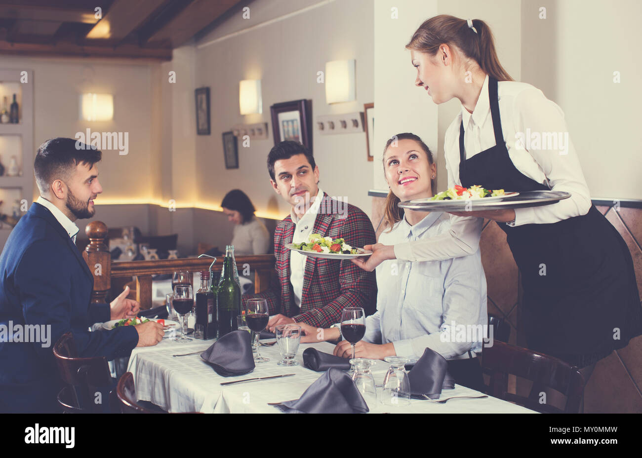 Attractive waitress serving meals hi-res stock photography and images ...