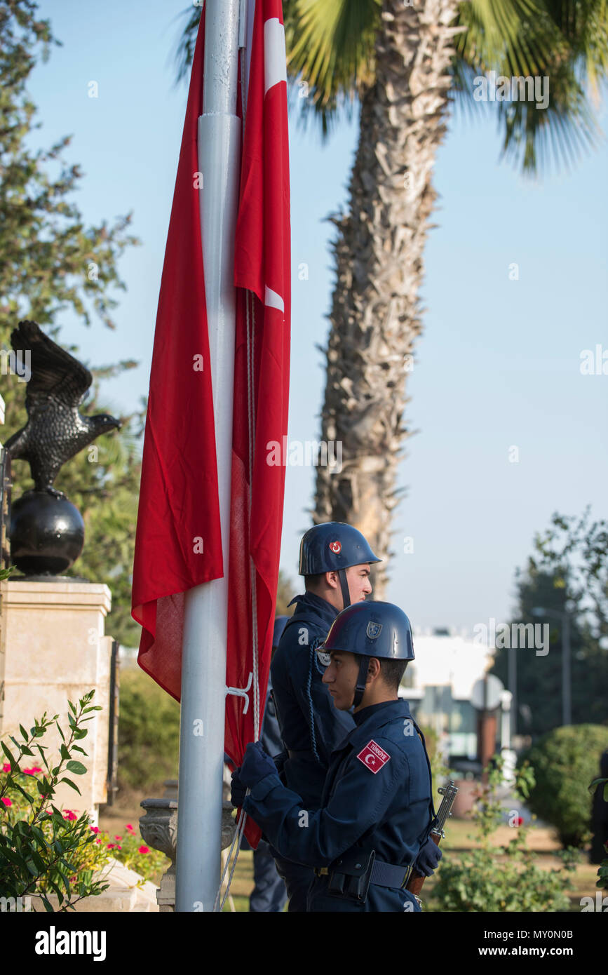 A member of the 10th Tanker Base Command honor guard lowers a Turkish ...