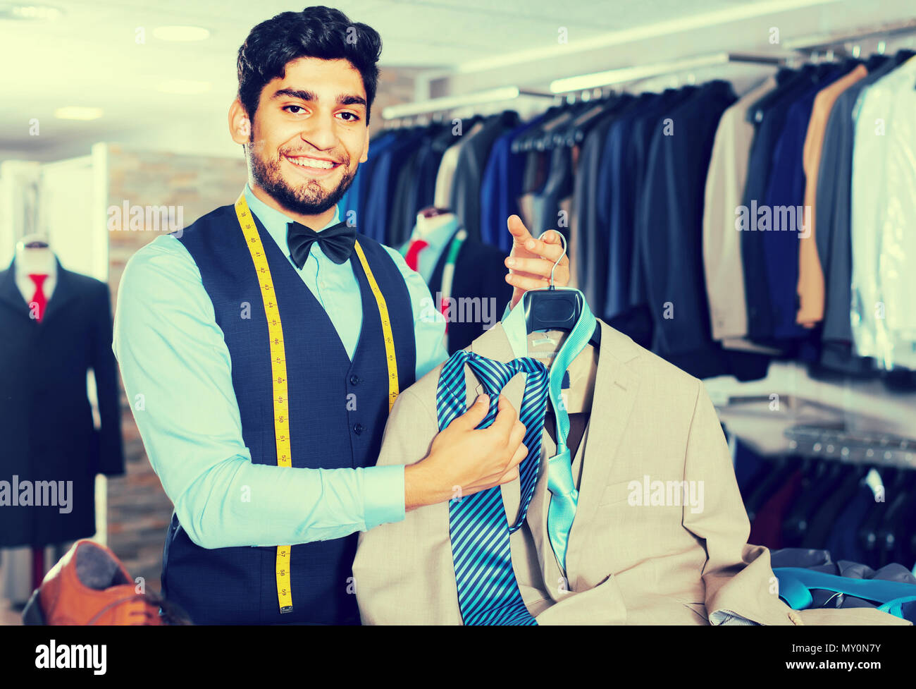 Guy picking up tie hi-res stock photography and images - Alamy