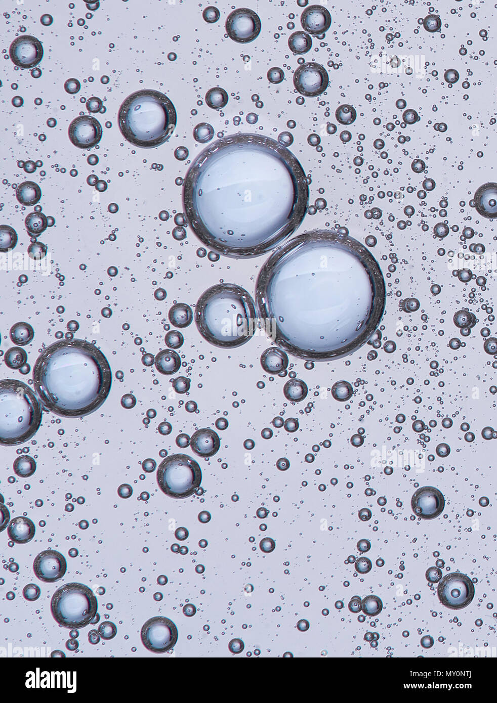 Full frame of the textures formed by the bubbles and drops of oil in ...