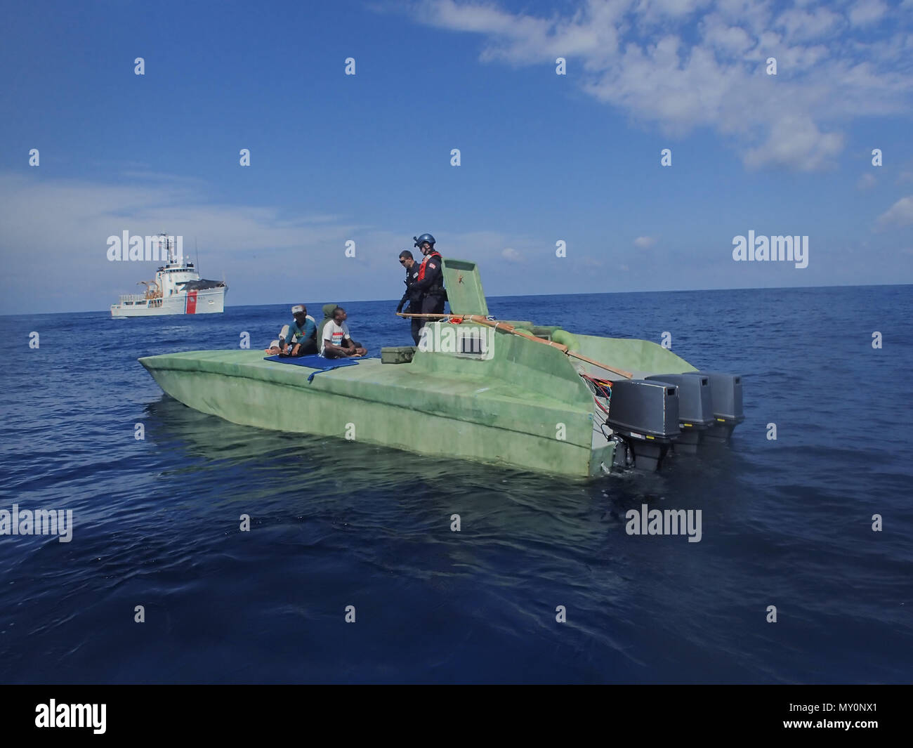 Coast Guard Cutter Steadfast boarding team members intercept a ...