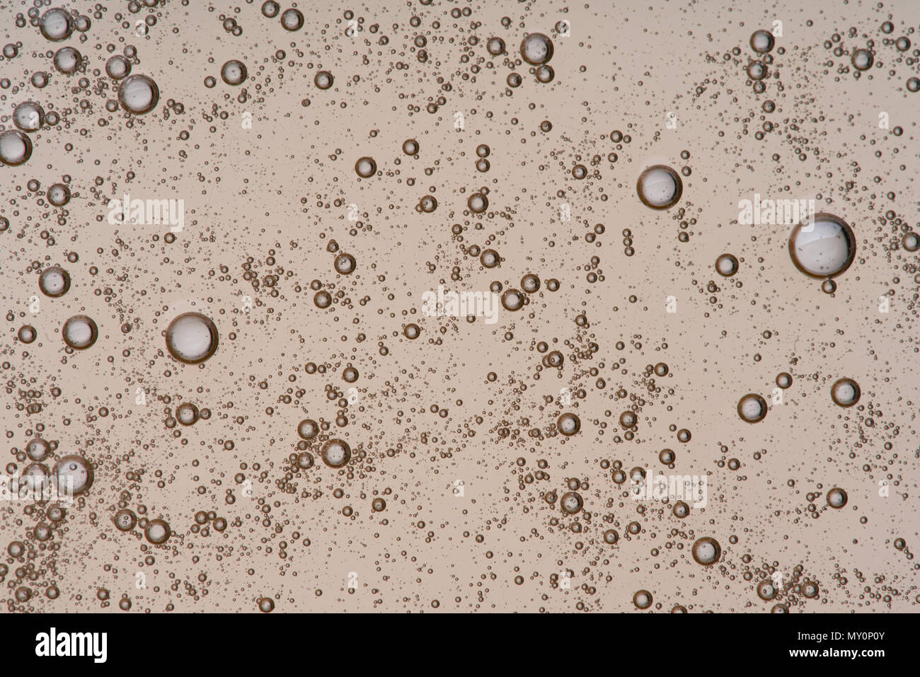Full frame of the textures formed by the bubbles and drops of oil in ...