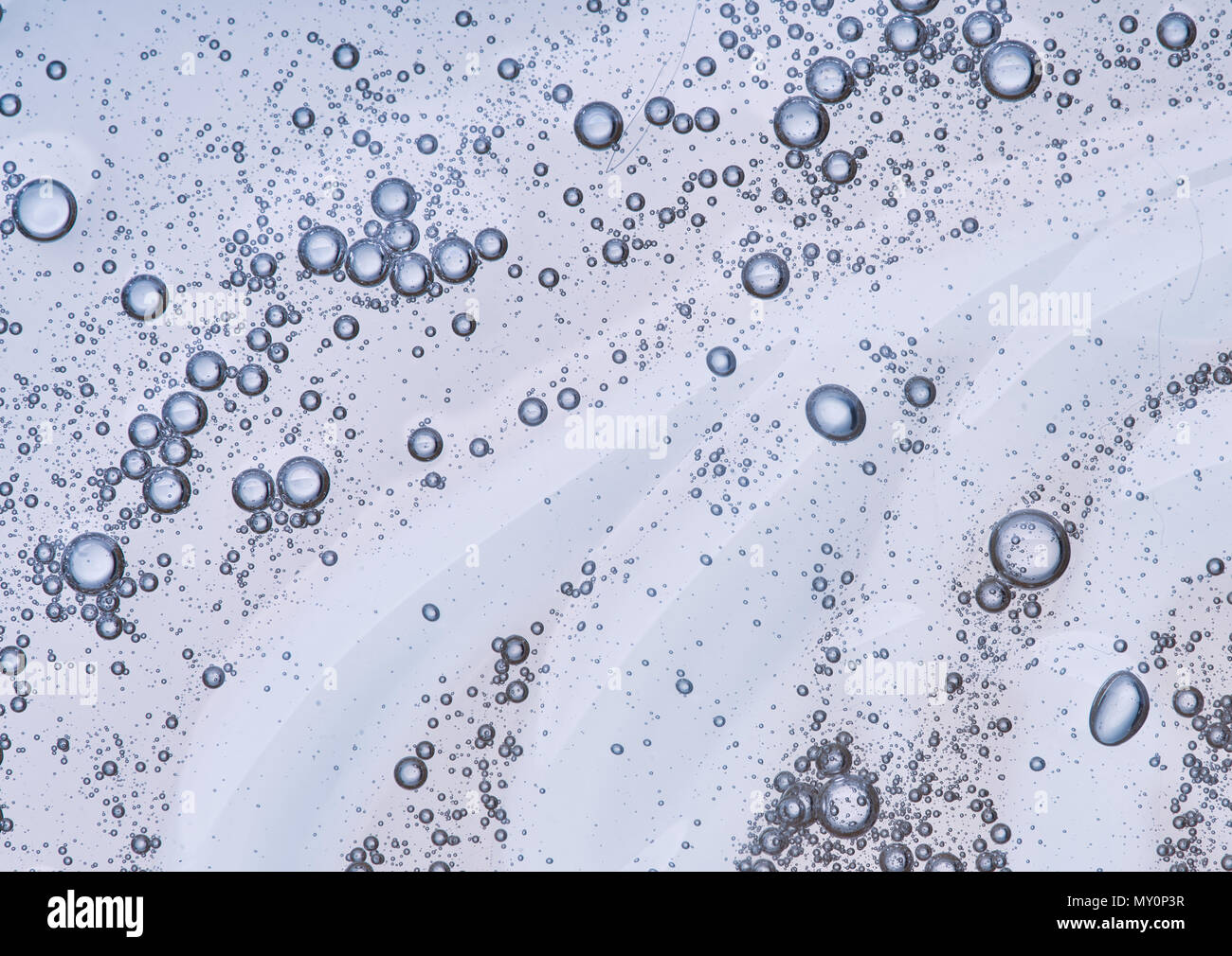 Full frame of the textures formed by the bubbles and drops of oil in ...