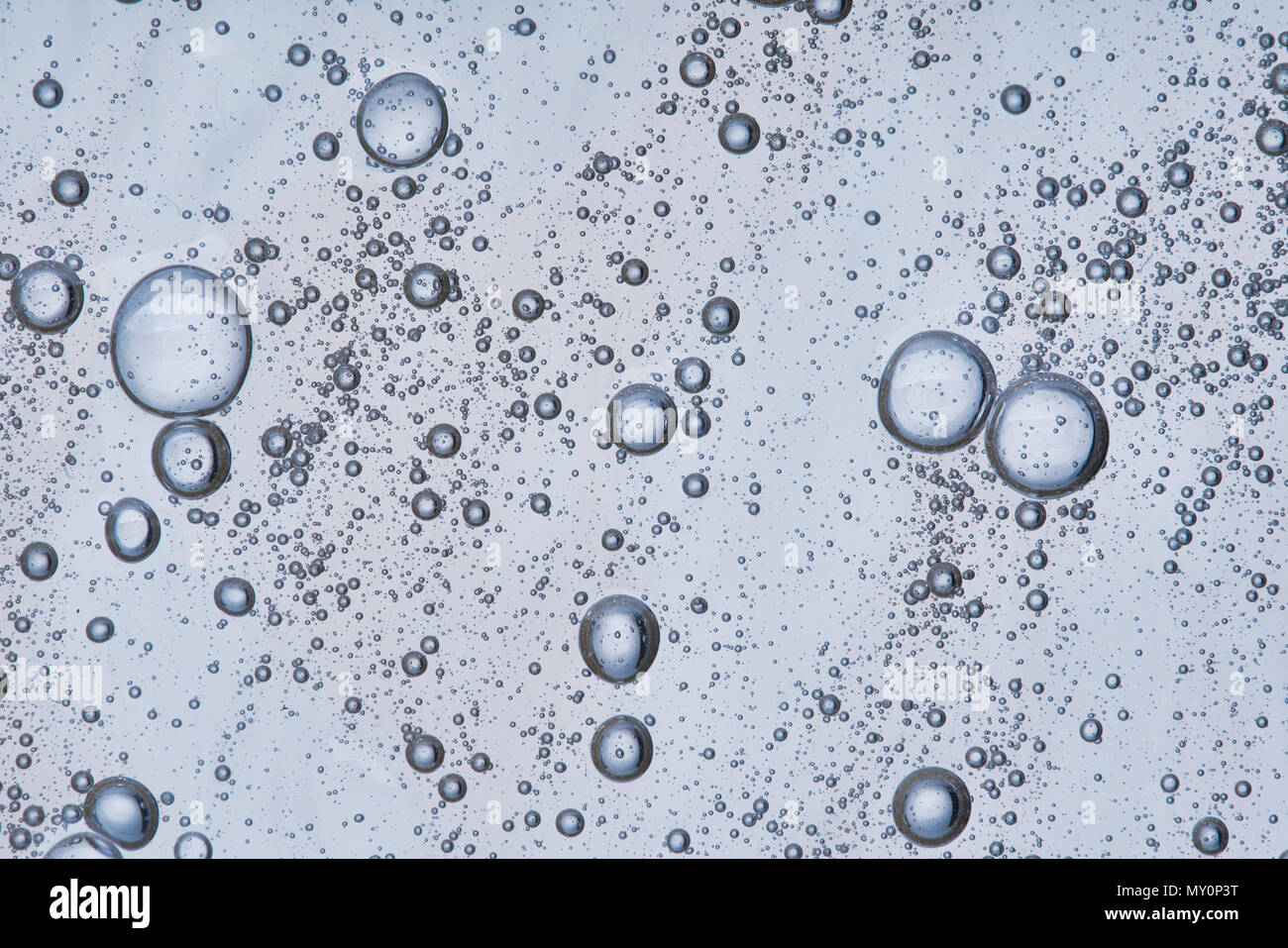 Full frame of the textures formed by the bubbles and drops of oil in ...