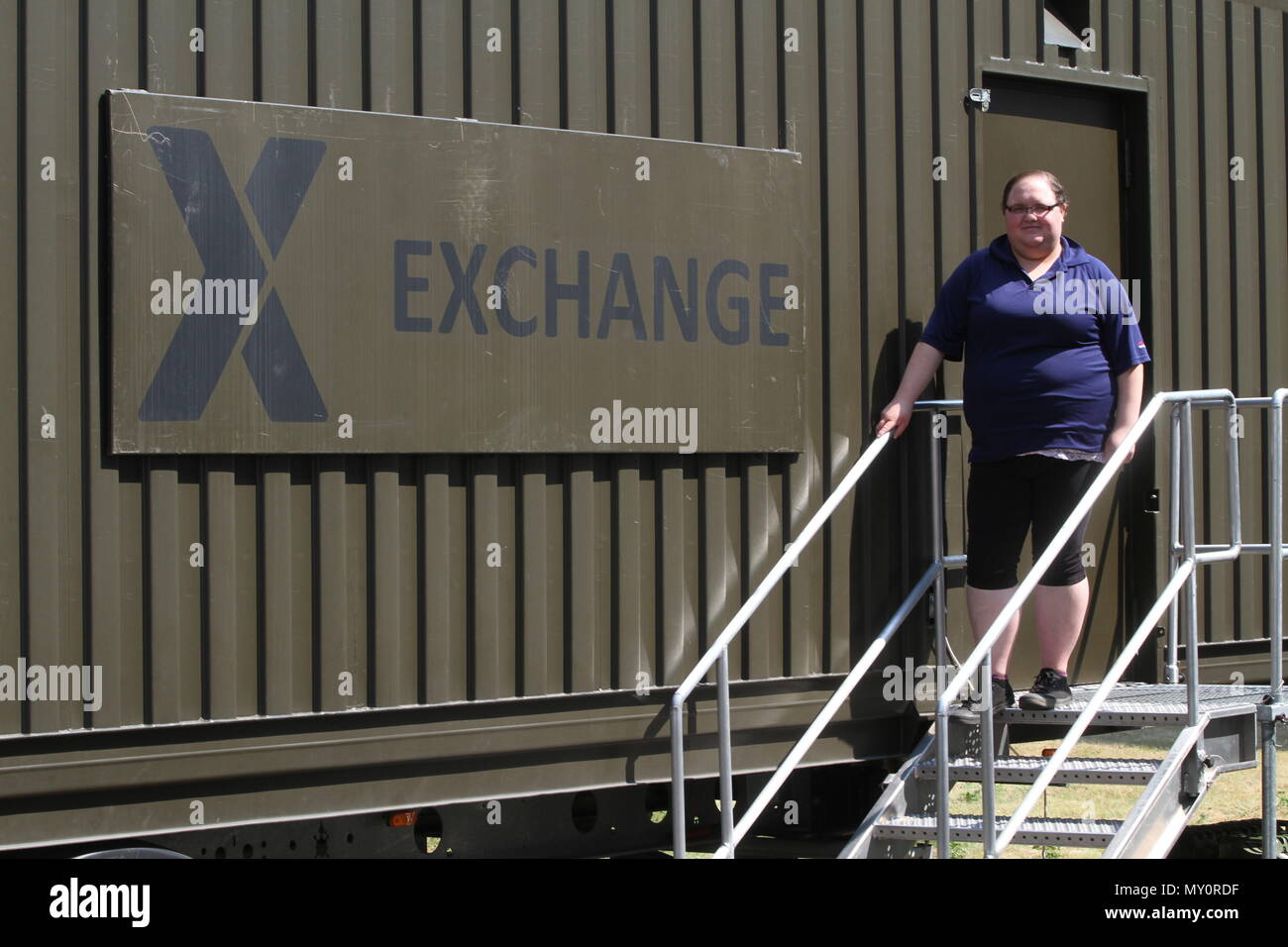 Ashlei Wyant, an AAFES employee, stands outside the new AAFES Mobile ...