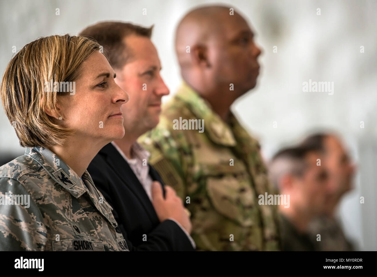 Col. Jennifer Short, left, 23d Wing Commander, stands at attention ...