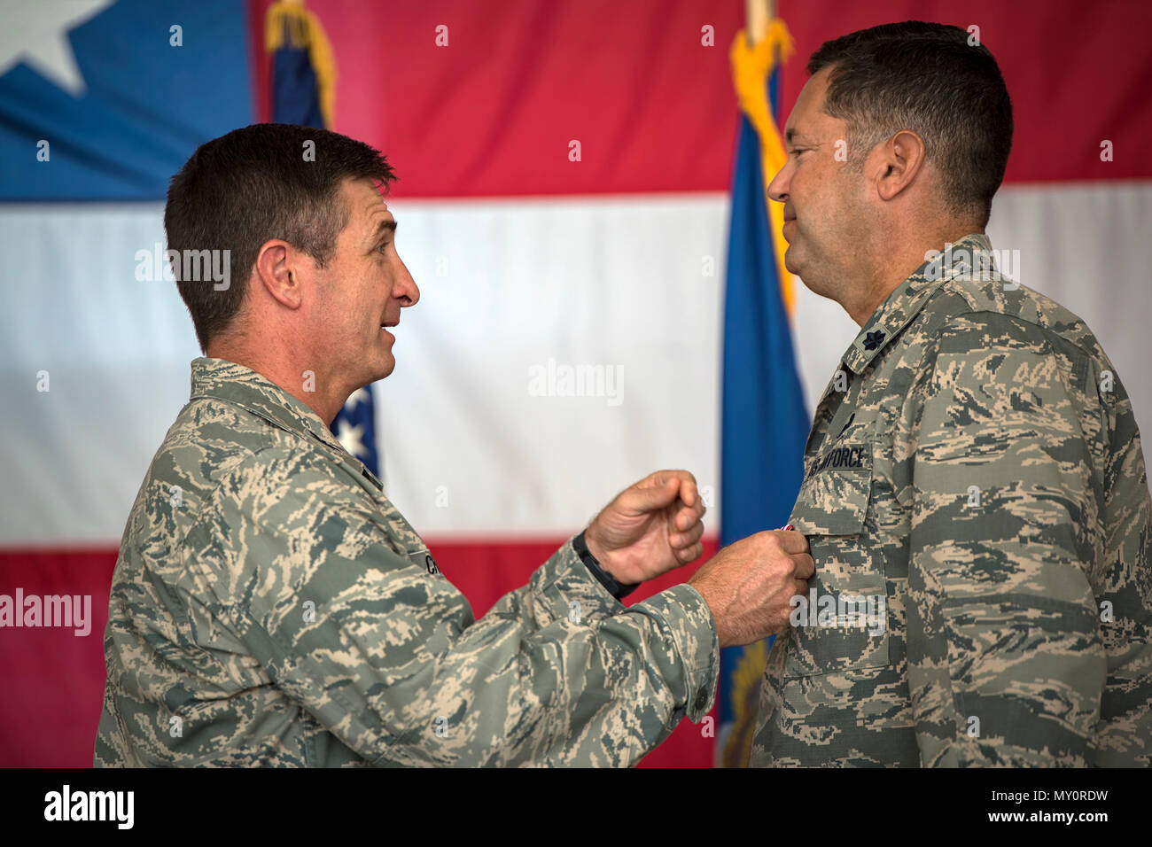Col. John Chastain, left, 23d Maintenance Group commander, pins the ...