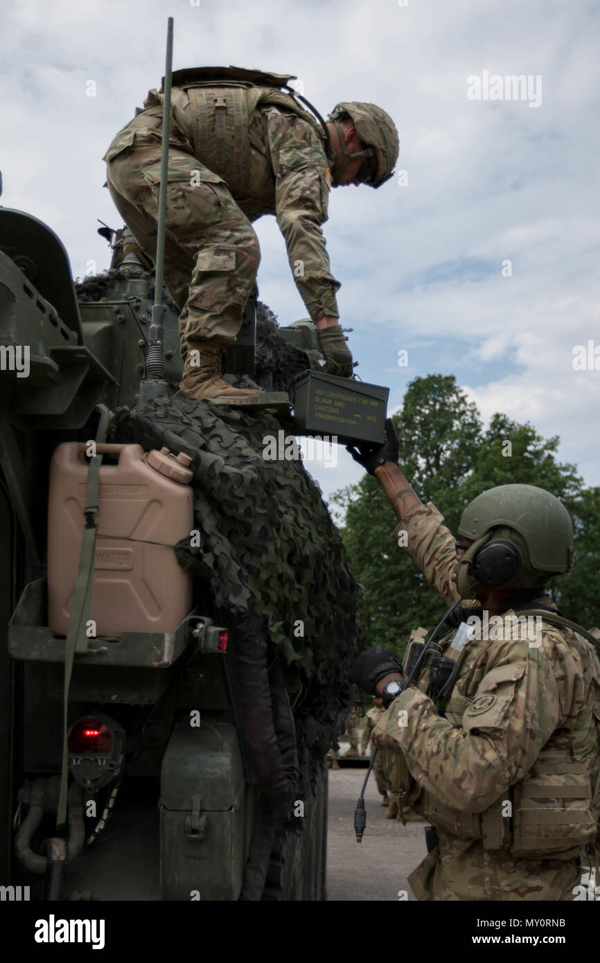 2d Cavalry Regiment Soldiers load simulated ammunition onto their ...