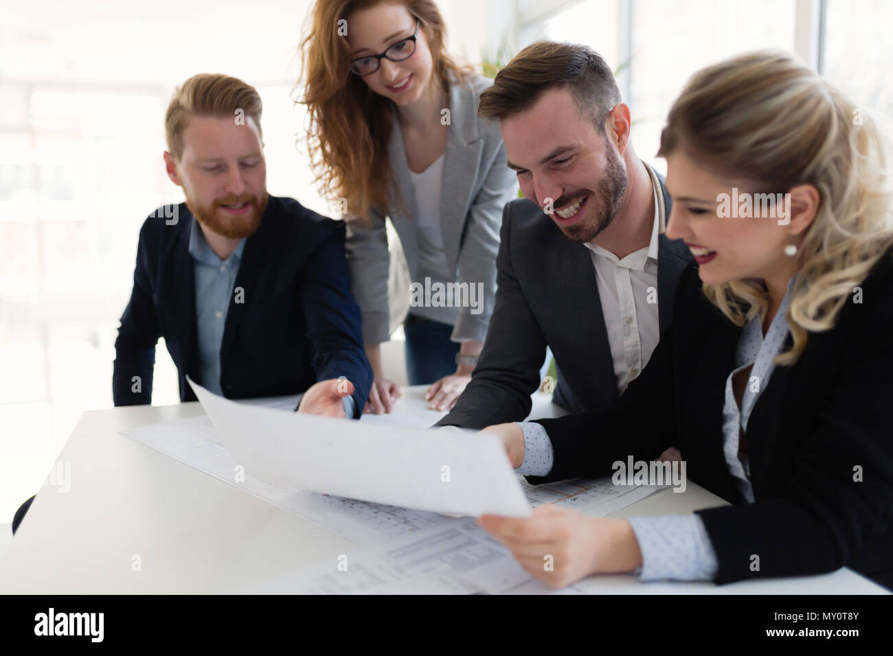 Group of architects working together on project Stock Photo - Alamy