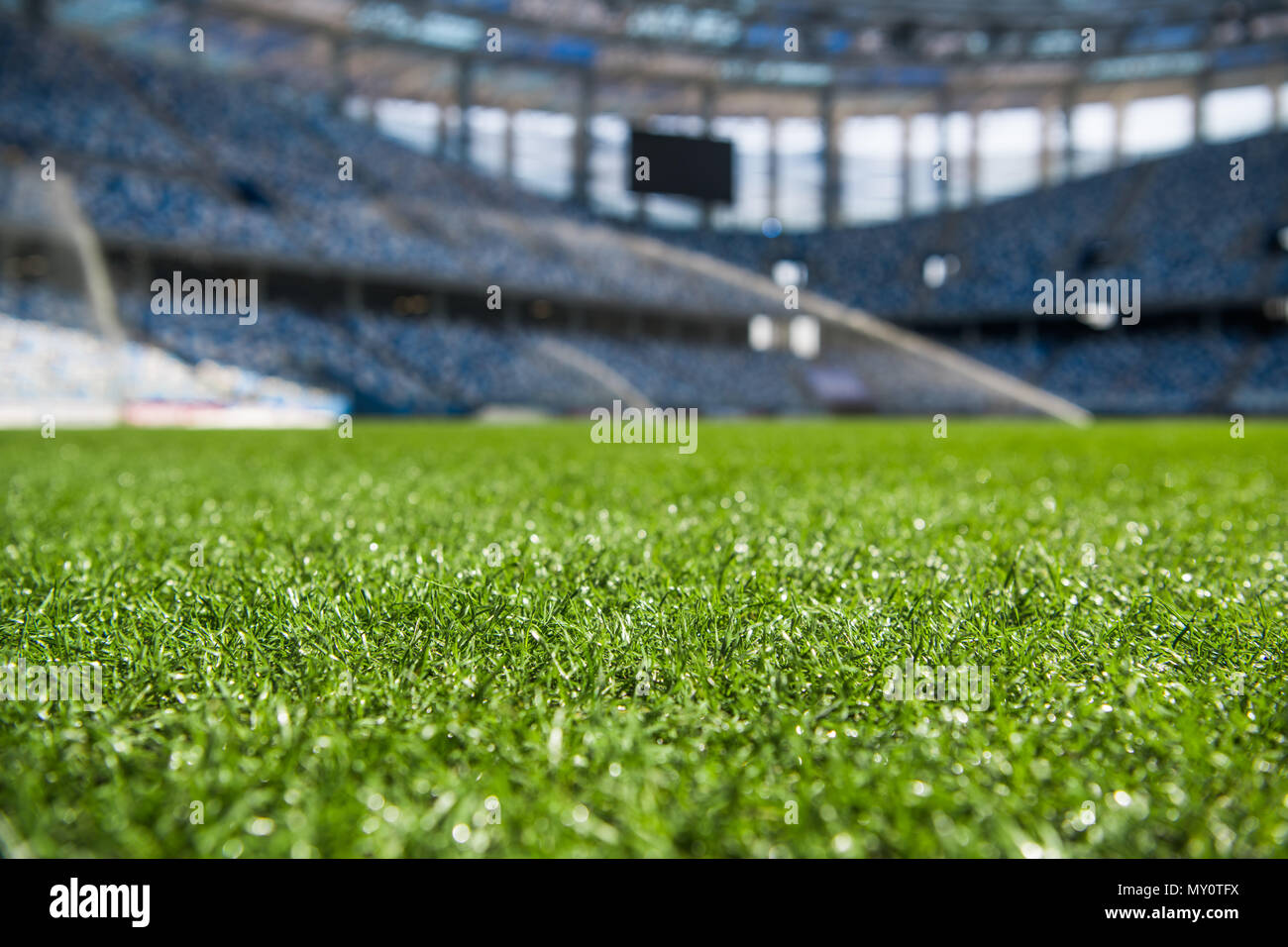 Irrigation turf. Sprinkler watering football field Stock Photo - Alamy