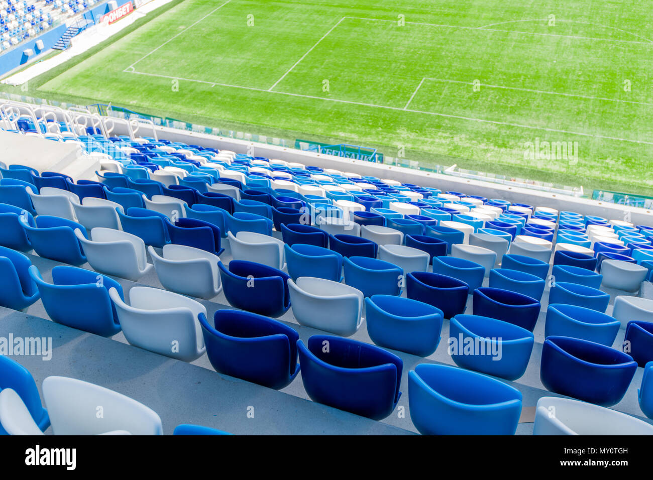 Blue seats on the tribune of the stadium Stock Photo - Alamy