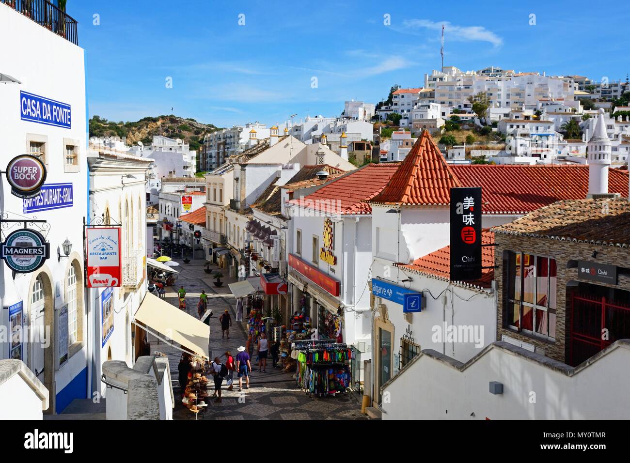 Elevated view of tourists walking along the Rua 5 Octubro shopping ...