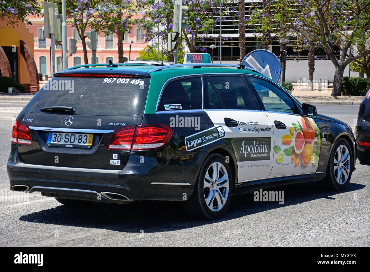 Mercedes taxi with advertising on the side, Silves, Portugal, Europe ...