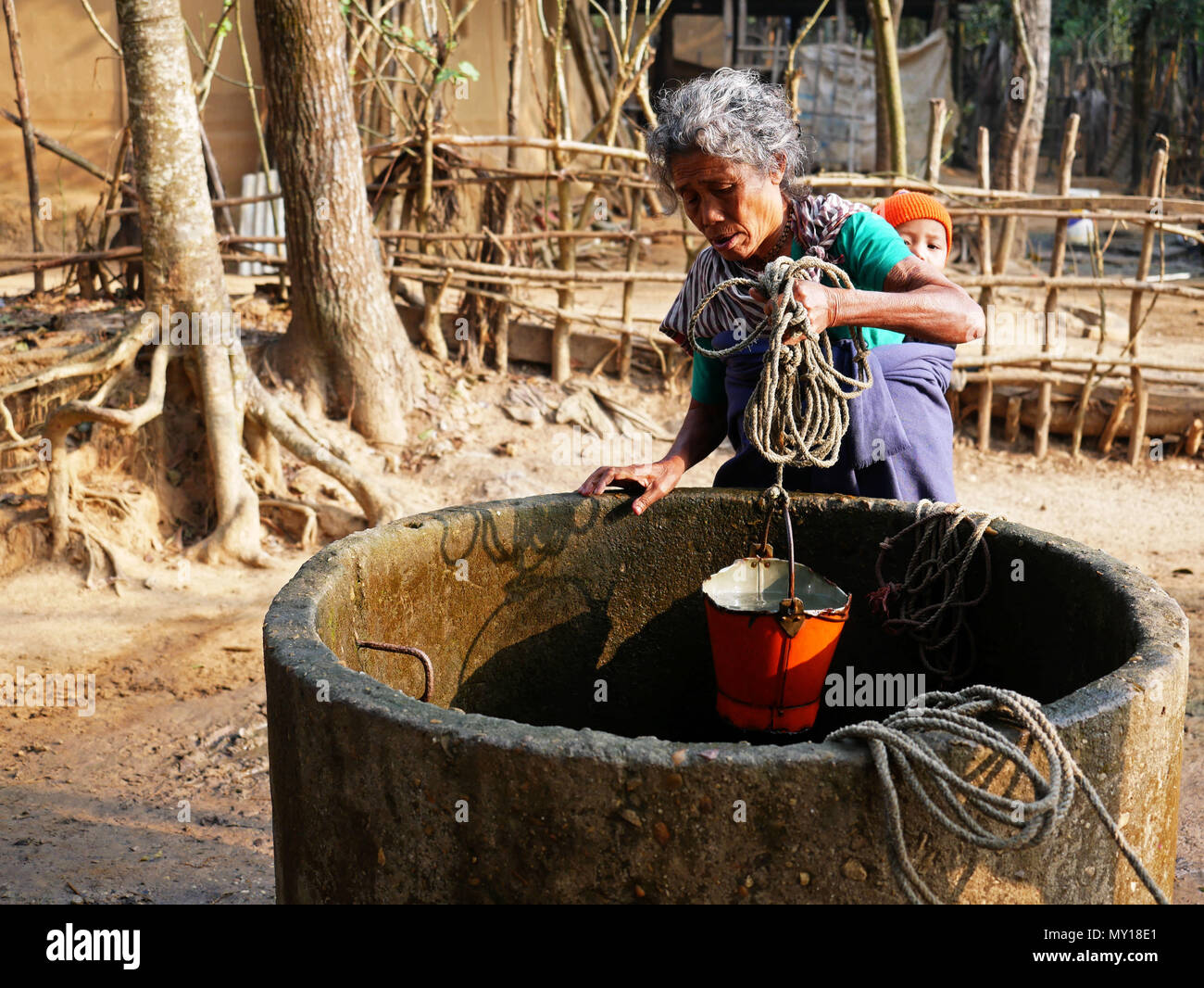 Woman fetching water from well hi-res stock photography and images - Alamy