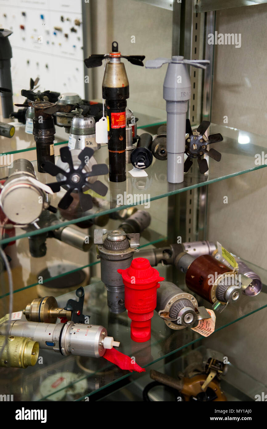 Explosive ordnance training aids sit in a display case at the 4th Civil ...