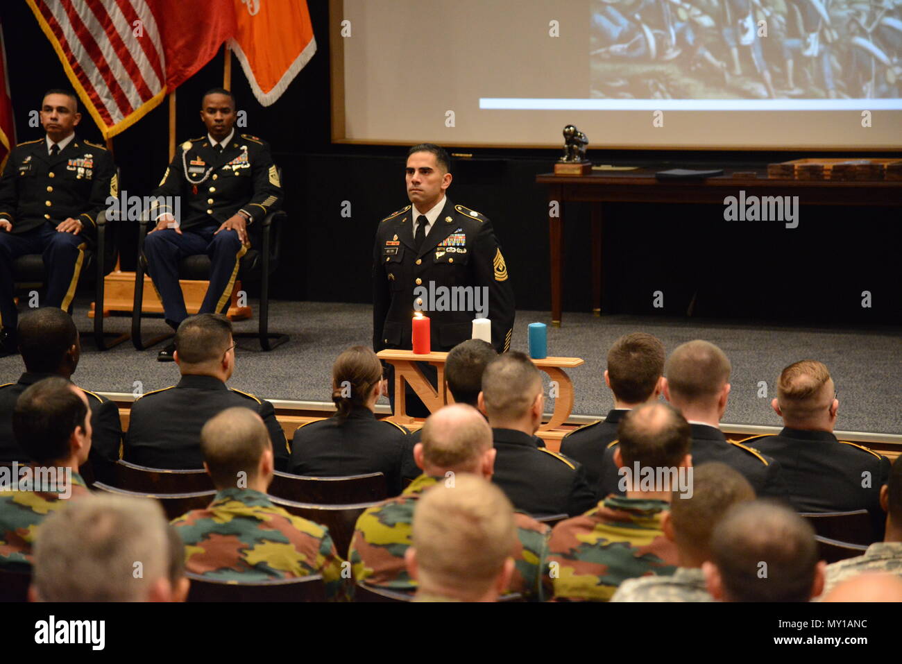 U.S. Army, 1st Sgt. Jason A. Melton, 39th Signal Battalion, lights a ...