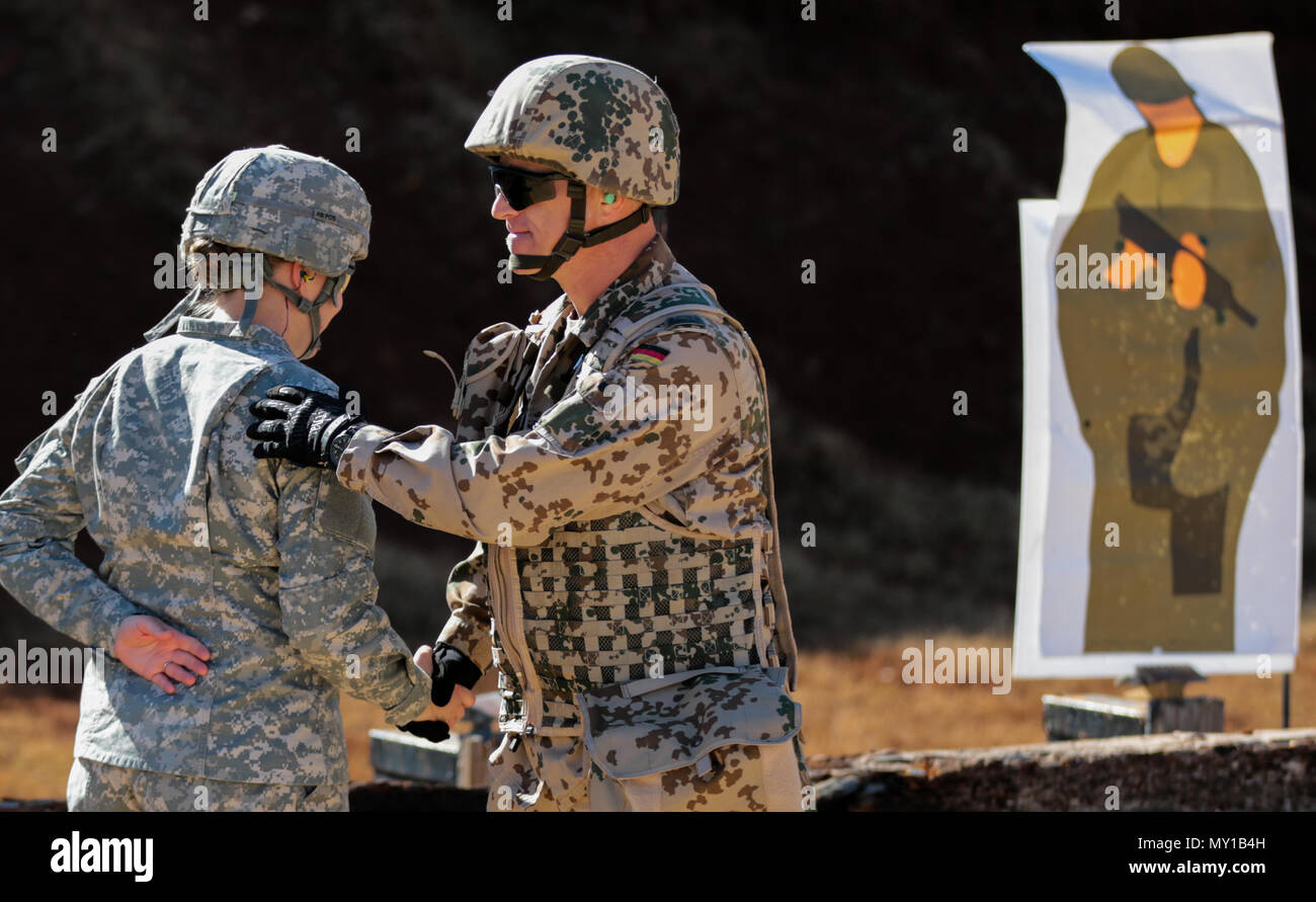 German army Sgt. Maj. Michael Kern congratulates U.S Army Sgt. Mara ...