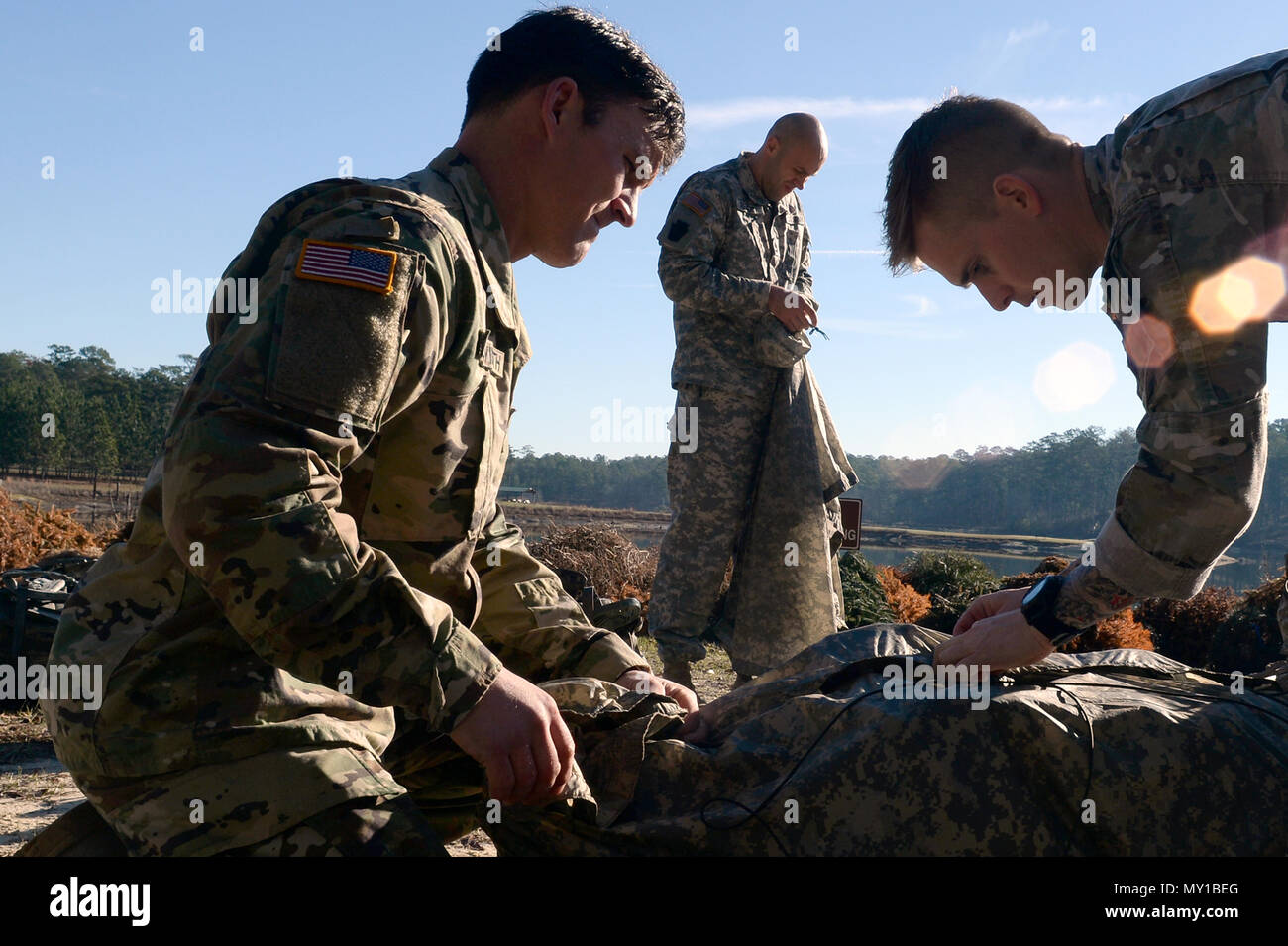 Soldiers from throughout the Army National Guard prepare rucksack rafts ...