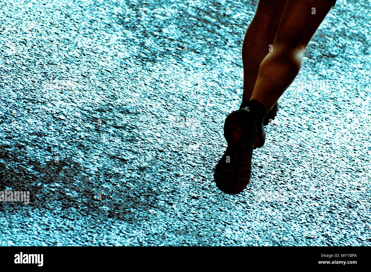 legs of a marathon runner during a competition Stock Photo - Alamy