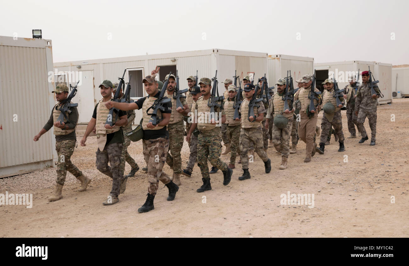 Iraqi members of 2nd Battalion, 4th Brigade, Border Guard Force, march ...