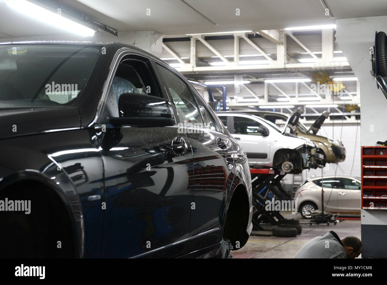 car in garage with special equipment prepared for repair Stock Photo ...