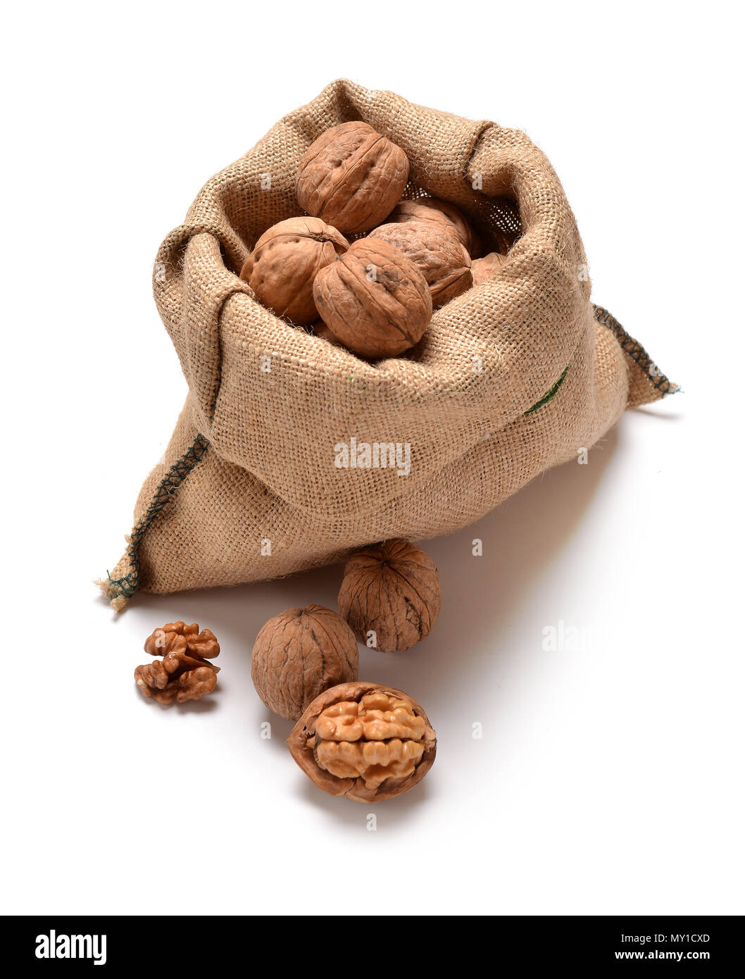 Walnuts and a bag on white Stock Photo - Alamy