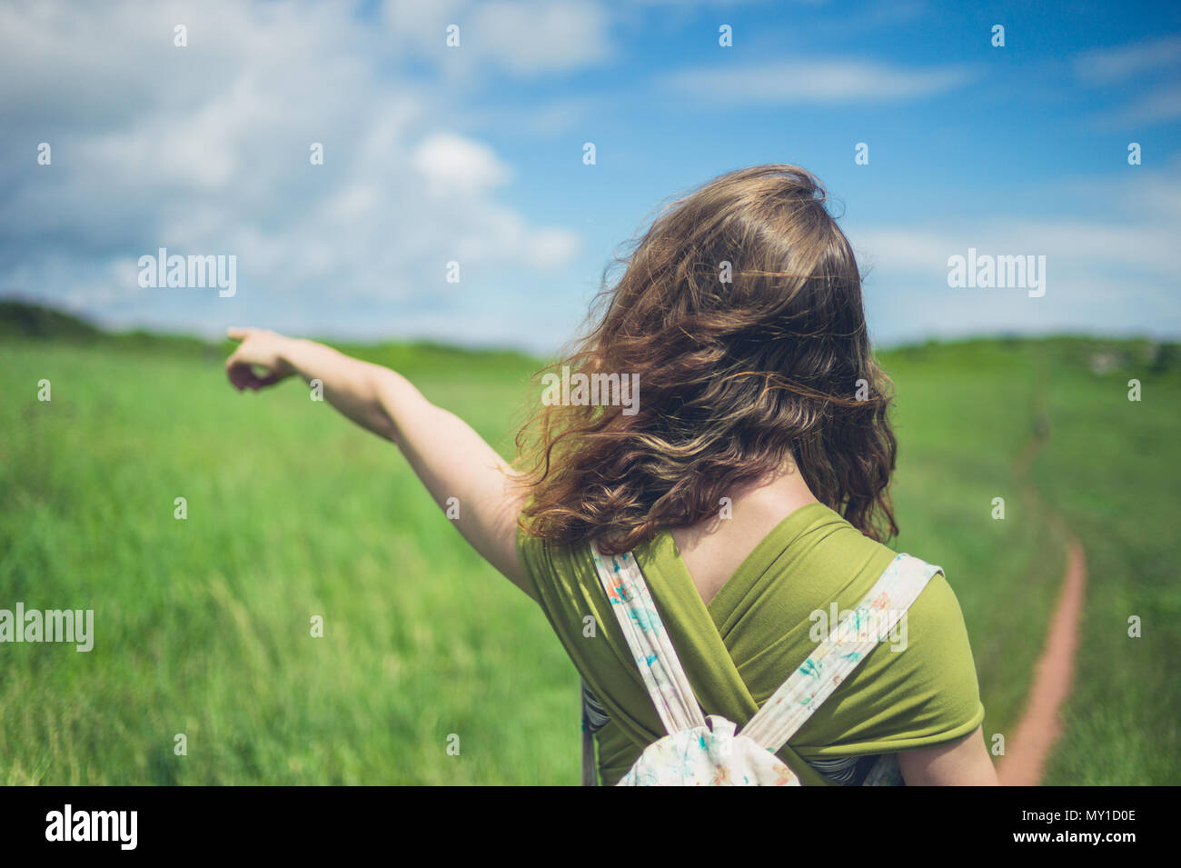 Woman pointing at sky hi-res stock photography and images - Alamy