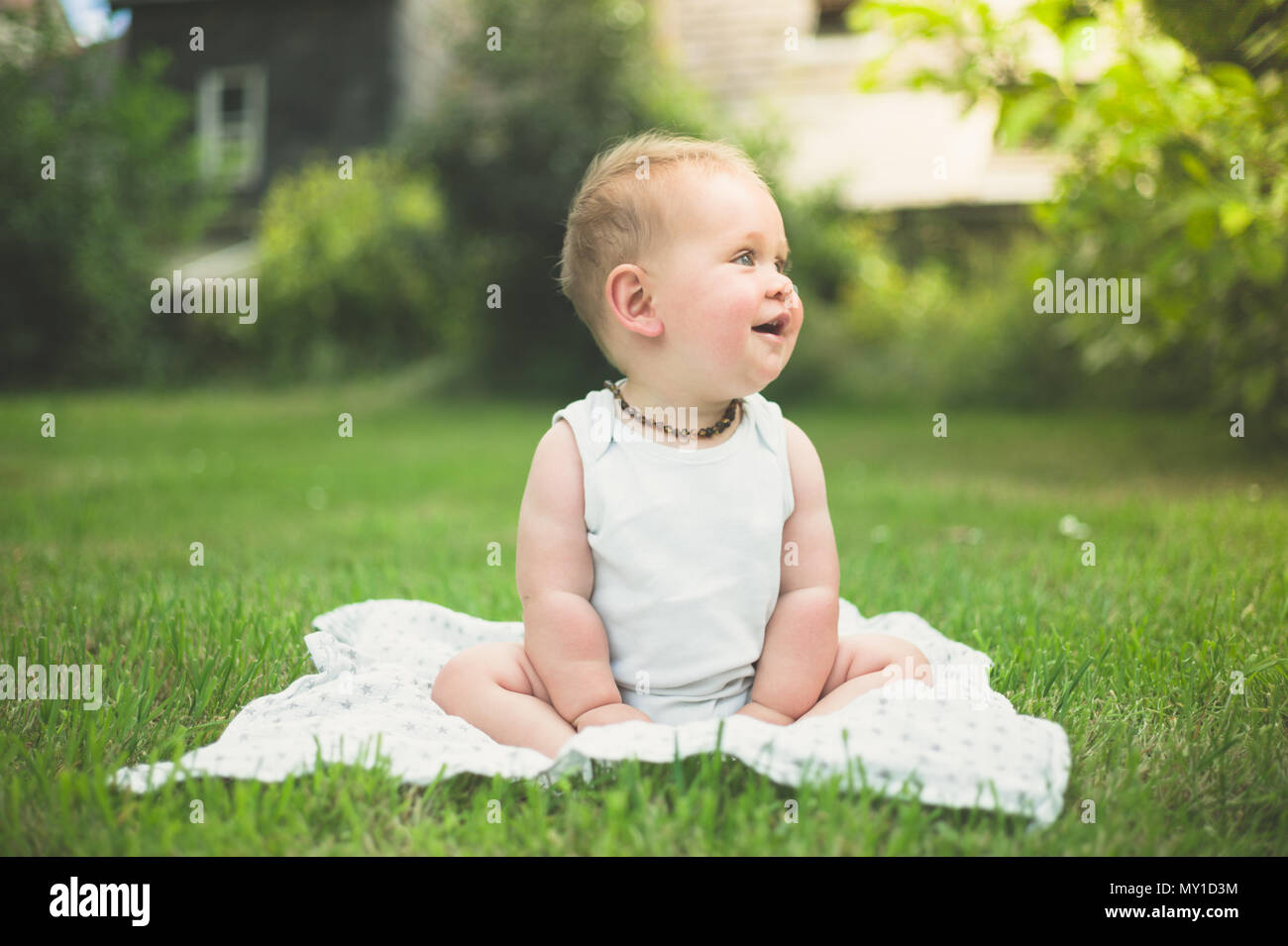 Baby boy sitting outside hi-res stock photography and images - Alamy