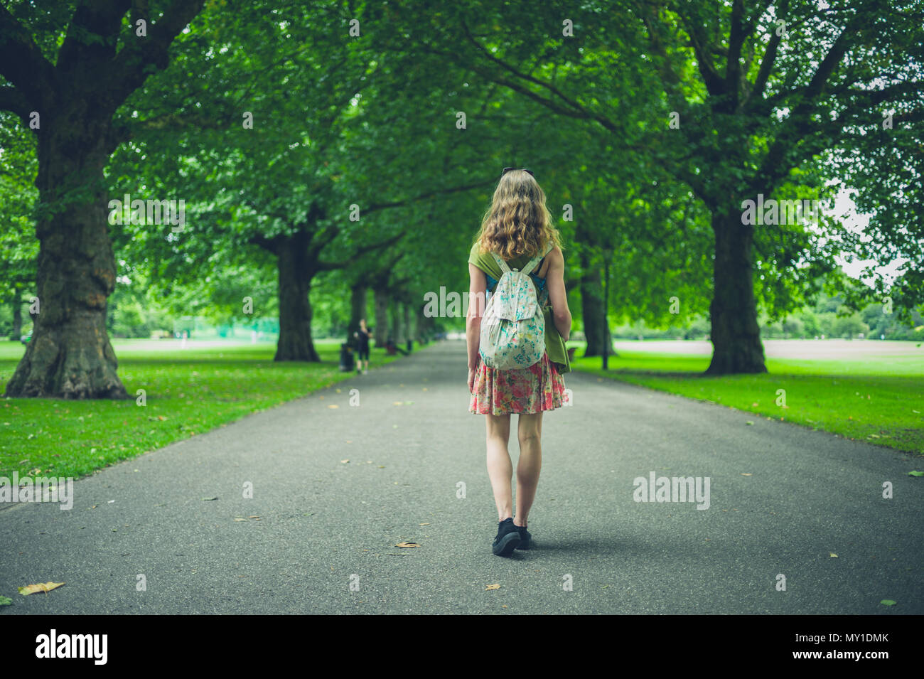 Woman walking promenade trees hi-res stock photography and images - Alamy