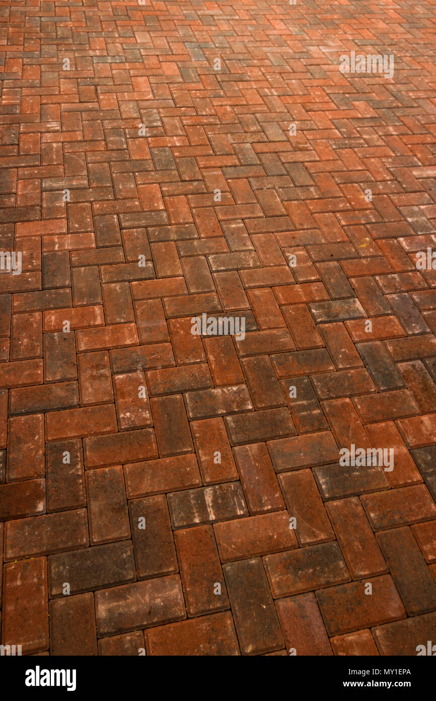 New orange bricks forming background on patio Stock Photo - Alamy