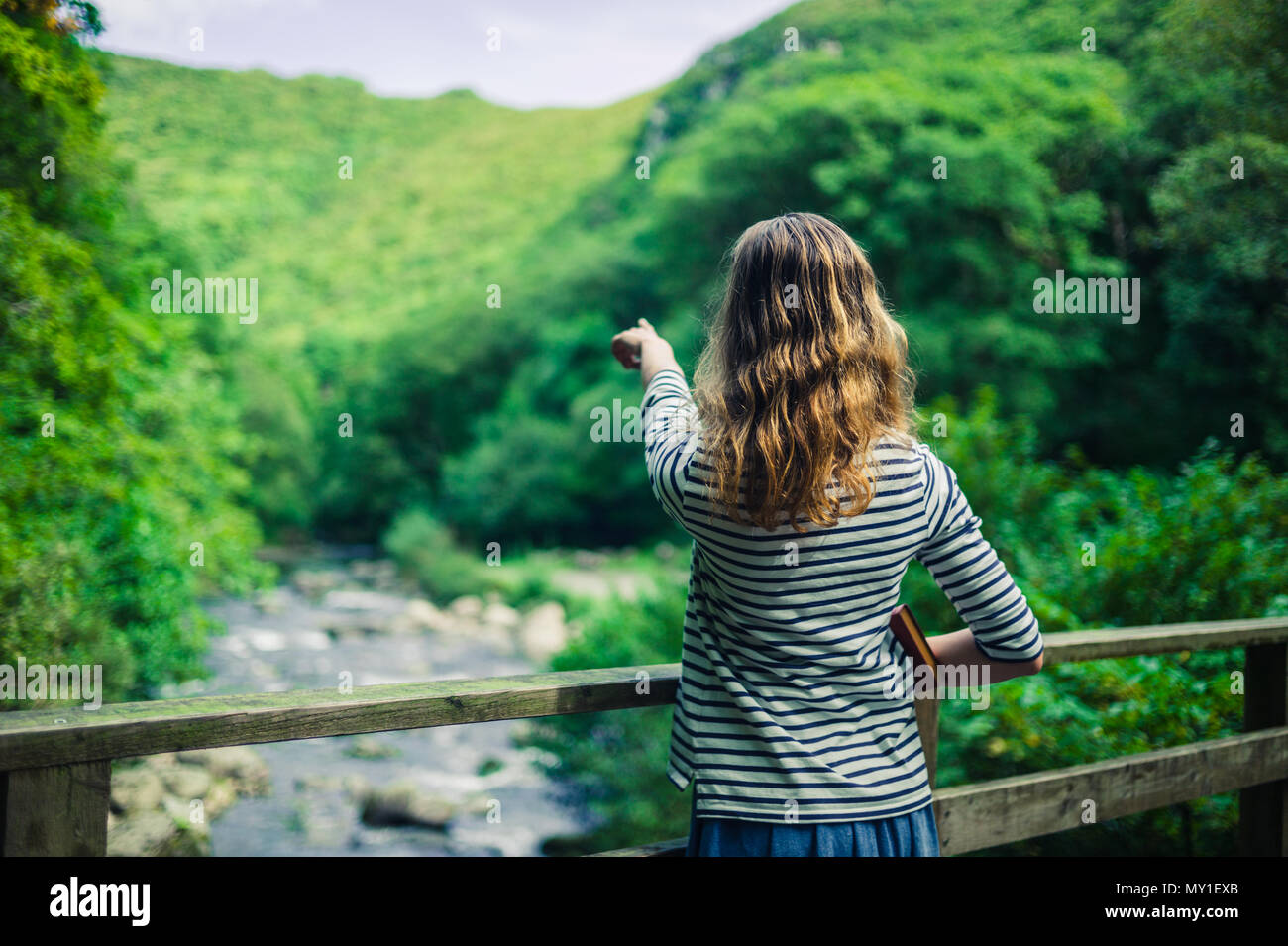 Woman bridge summer trees hi-res stock photography and images - Alamy