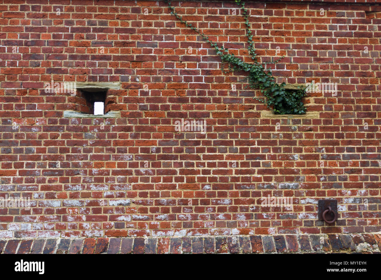 Wall with loopholes for defence during World War Two Stock Photo - Alamy