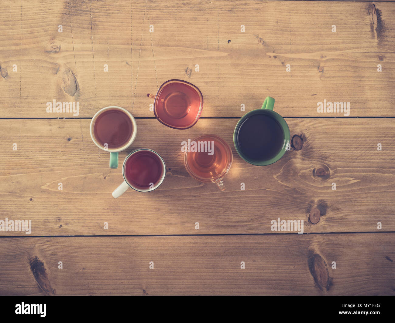 Overhead shot of five cups of tea Stock Photo - Alamy