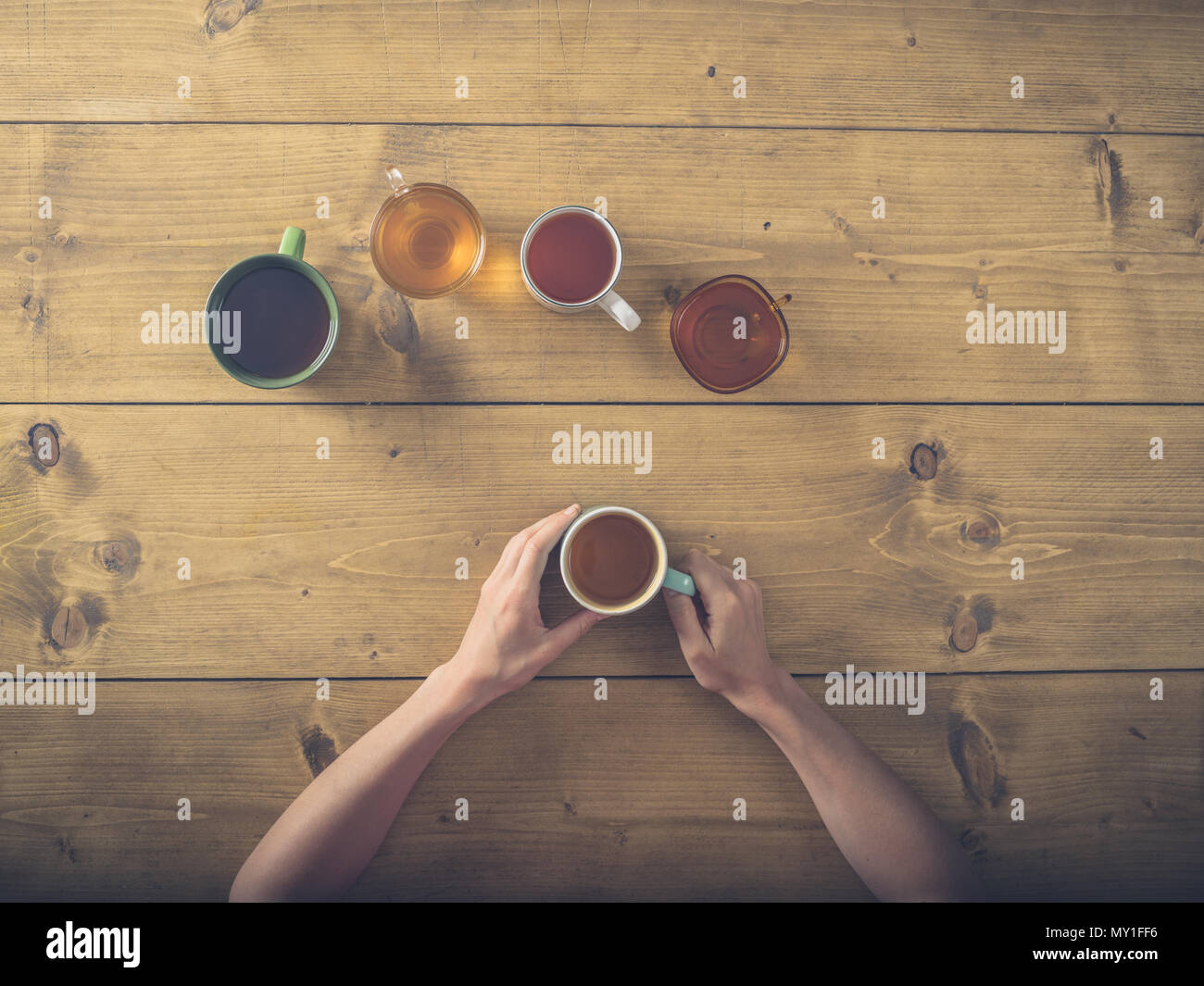Overhead hands table hi-res stock photography and images - Alamy