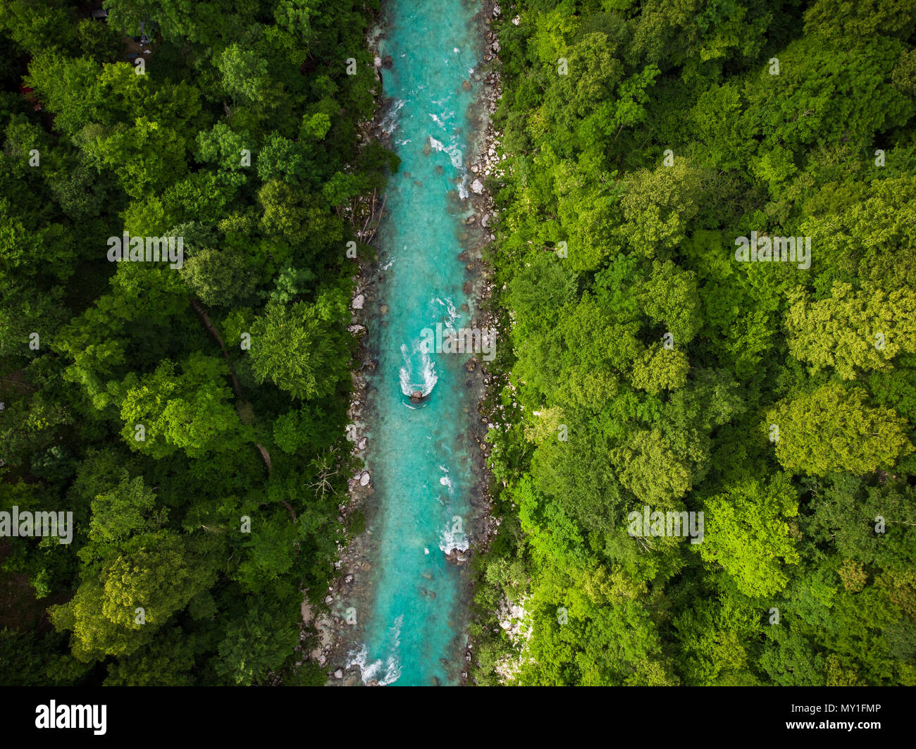 Symmetric pattern of Soca river and forest, aerial drone photo Stock ...