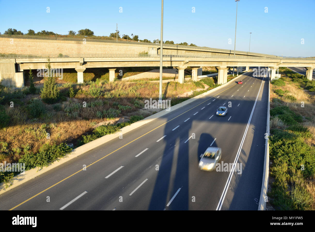 View of landscape with two way highway under evening light. Central ...