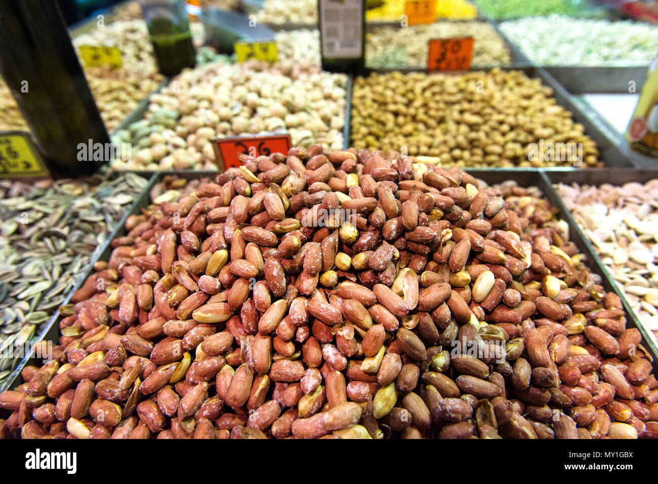 Different types of peanuts, nuts, almond, walnut in the market. Mahane ...