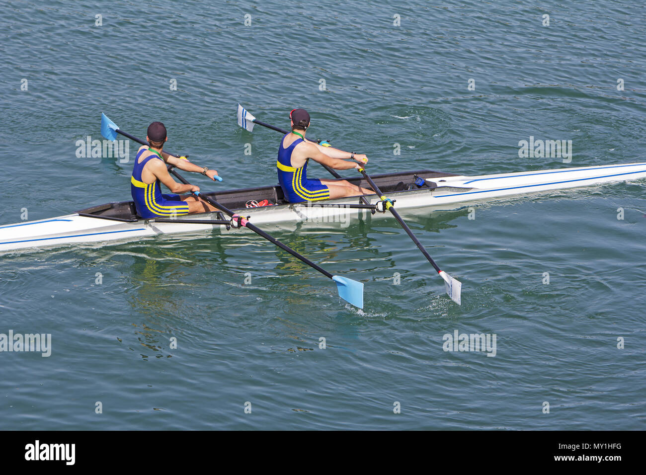 Two young rowers in a racing rower boat Stock Photo - Alamy