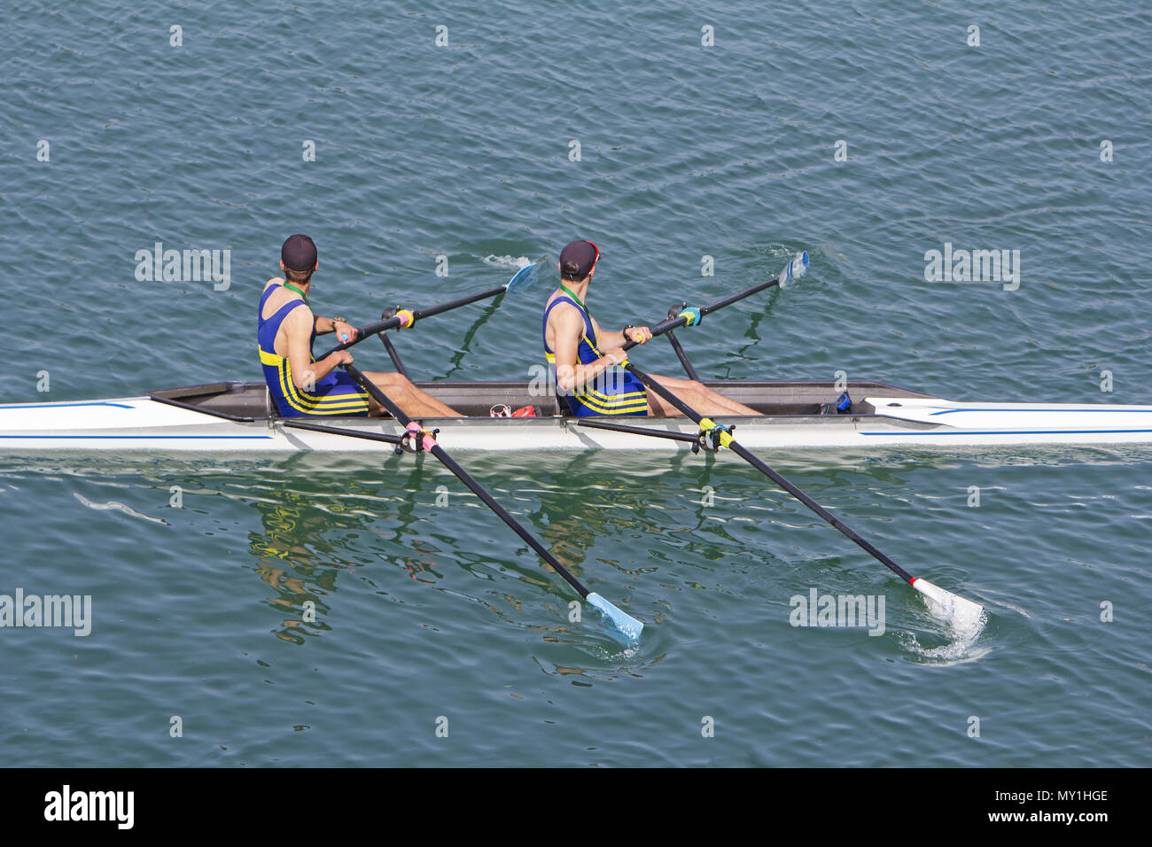 Two young rowers in a racing rower boat Stock Photo - Alamy