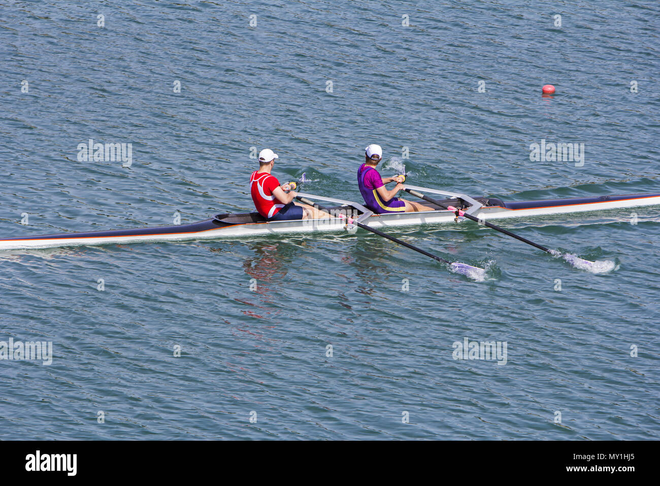 Two young rowers in a racing rower boat Stock Photo - Alamy