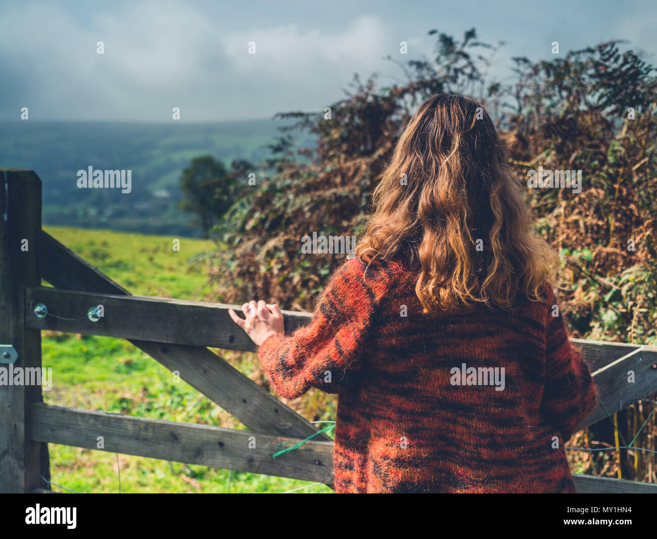Standing by a wooden gate and fence hi-res stock photography and images ...