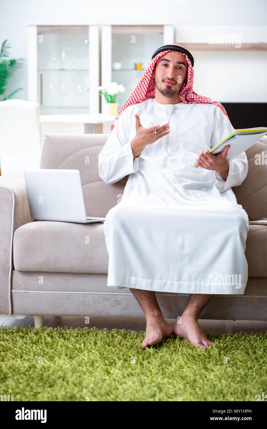 Arab man working at home on his work Stock Photo - Alamy