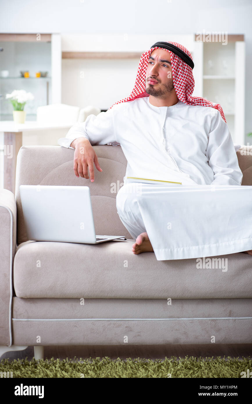 Arab man working at home on his work Stock Photo - Alamy