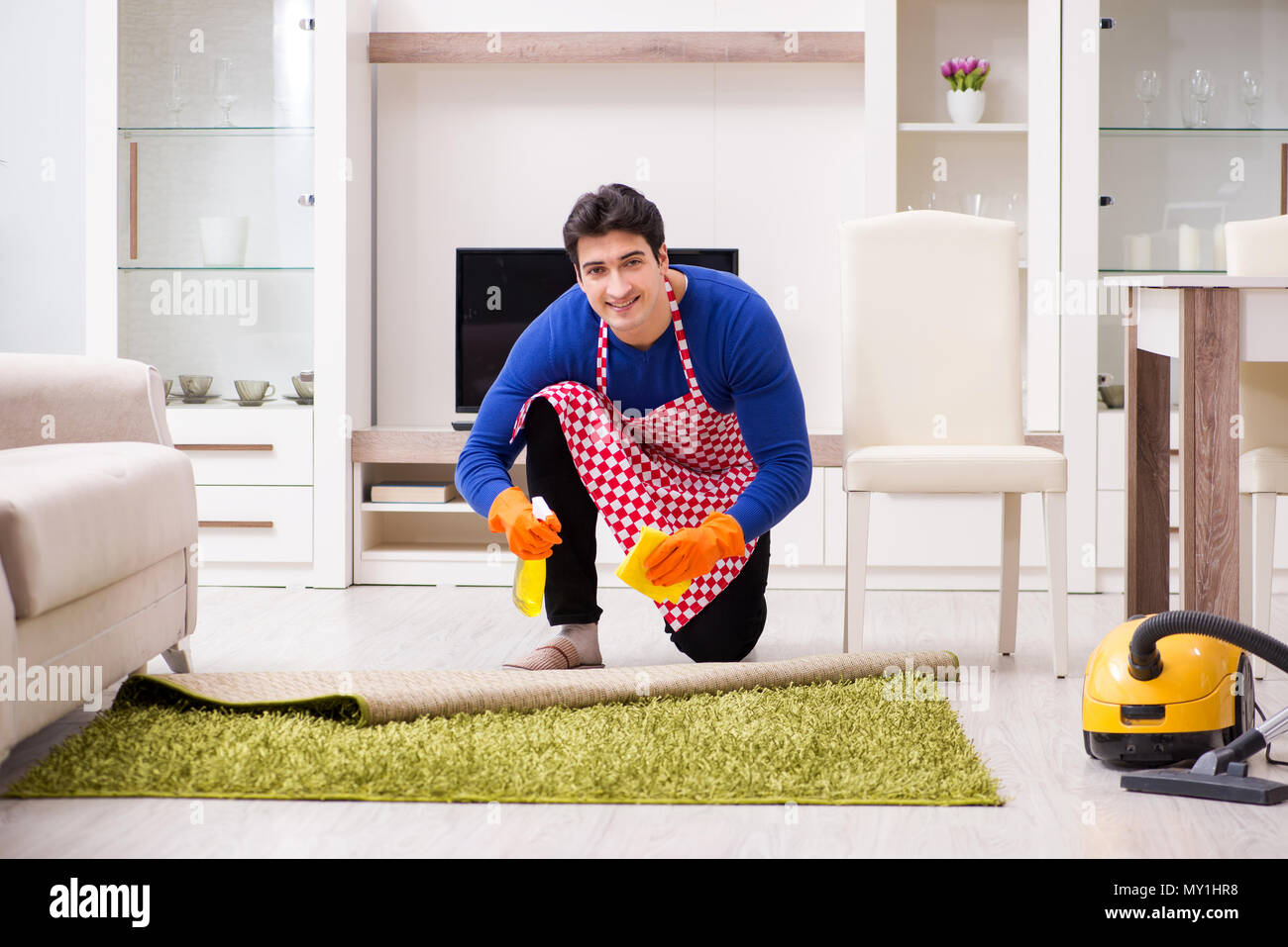 Contractor man cleaning house doing chores Stock Photo - Alamy