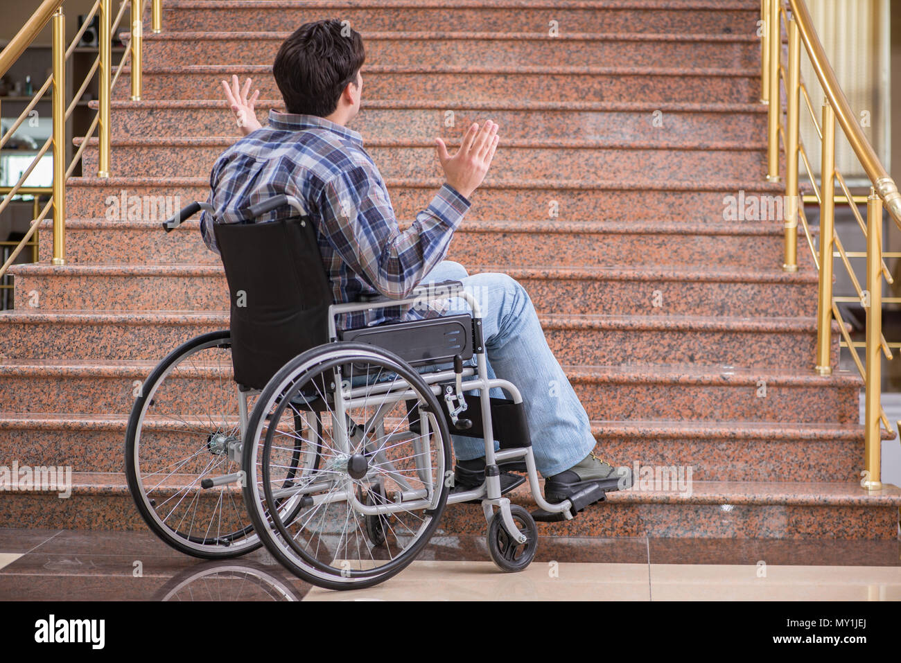 Disabled man on wheelchair having trouble with stairs Stock Photo - Alamy