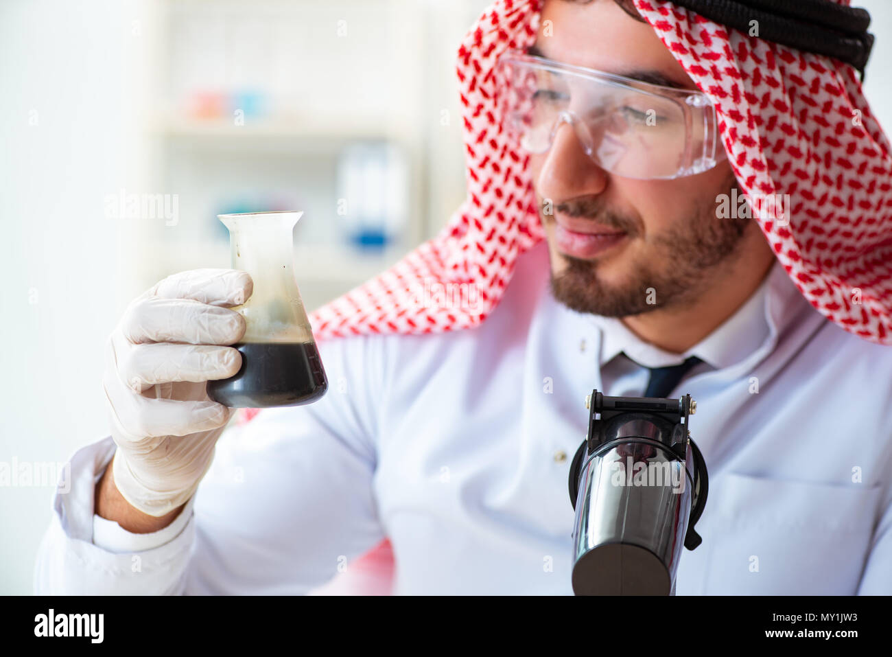 Arab chemist scientist testing quality of oil petrol Stock Photo - Alamy