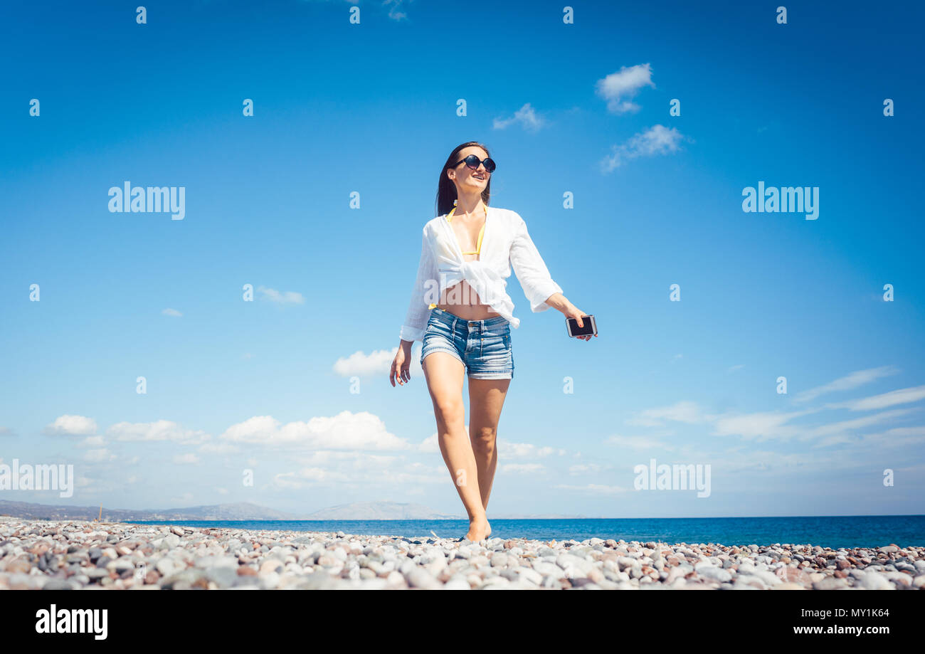 Bikini woman walking on beach hi-res stock photography and images - Alamy