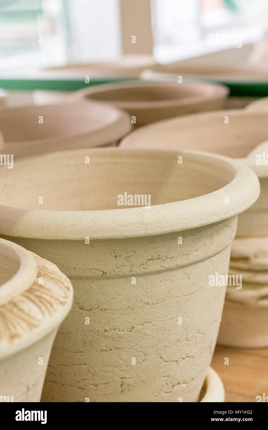 Large empty clay pots on the shelf Stock Photo - Alamy